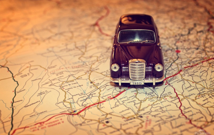 Hit the road - Travel concept with vintage miniature car on road map by ...