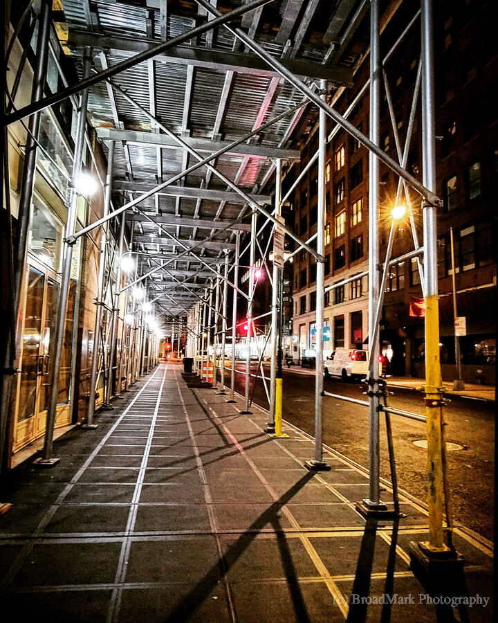 NYC Sidewalk Under the Scaffold Lights by BroadMark Photography Wall Art