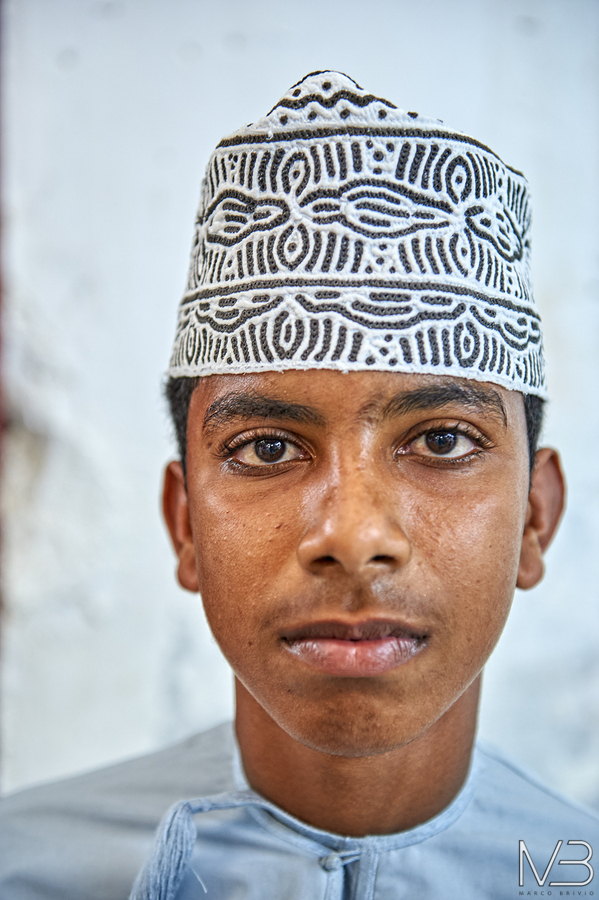Oman. Muscat. Portrait of omani boys by Marco Brivio Wall Art