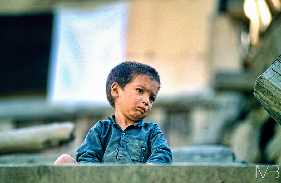 Pakistan. Portrait of a sad boy in Lahore by Marco Brivio Wall Art