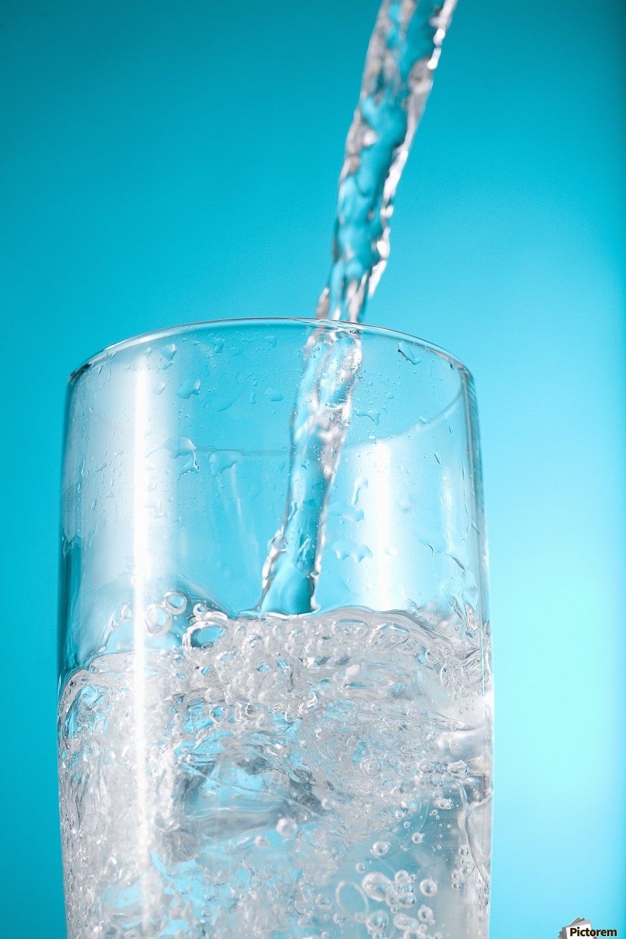 Stream Of Water Being Poured Into A Clear Glass by PacificStock Wall Art