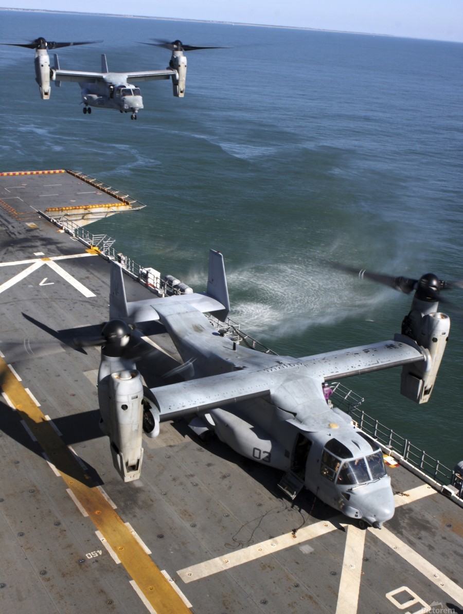 Two MV-22 Ospreys land on the flight deck of USS Nassau. by StocktrekImages Wall Art