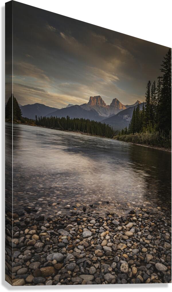 Soft orange sunset over The Three Sisters in Canmore. by Martin ...