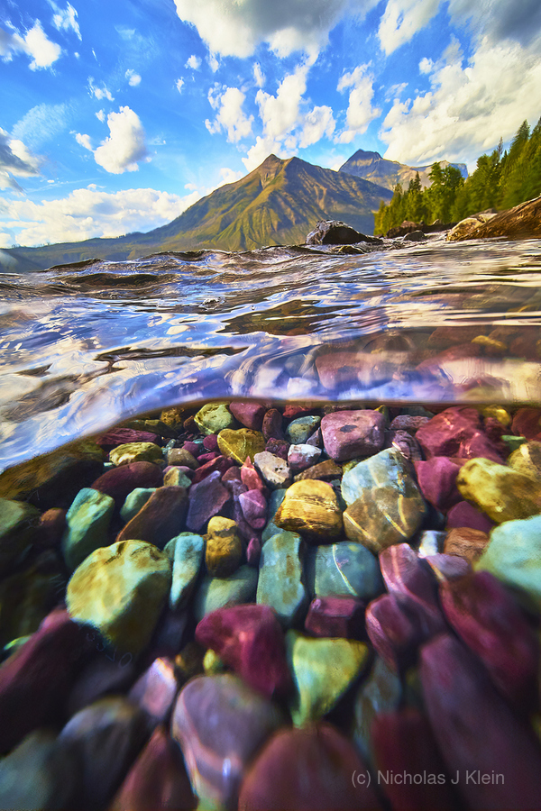 Split Shot Underwater View of Colorful Lake Rocks and Mountain ...
