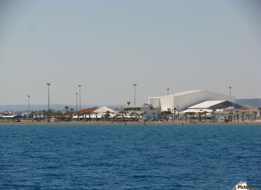 Modern buildings and trees on Cypriot shore in Larnaca by Vlad Radulian ...