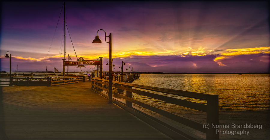 Harbour Town Dock Sunset Sign by Norma Brandsberg Photography Wall Art